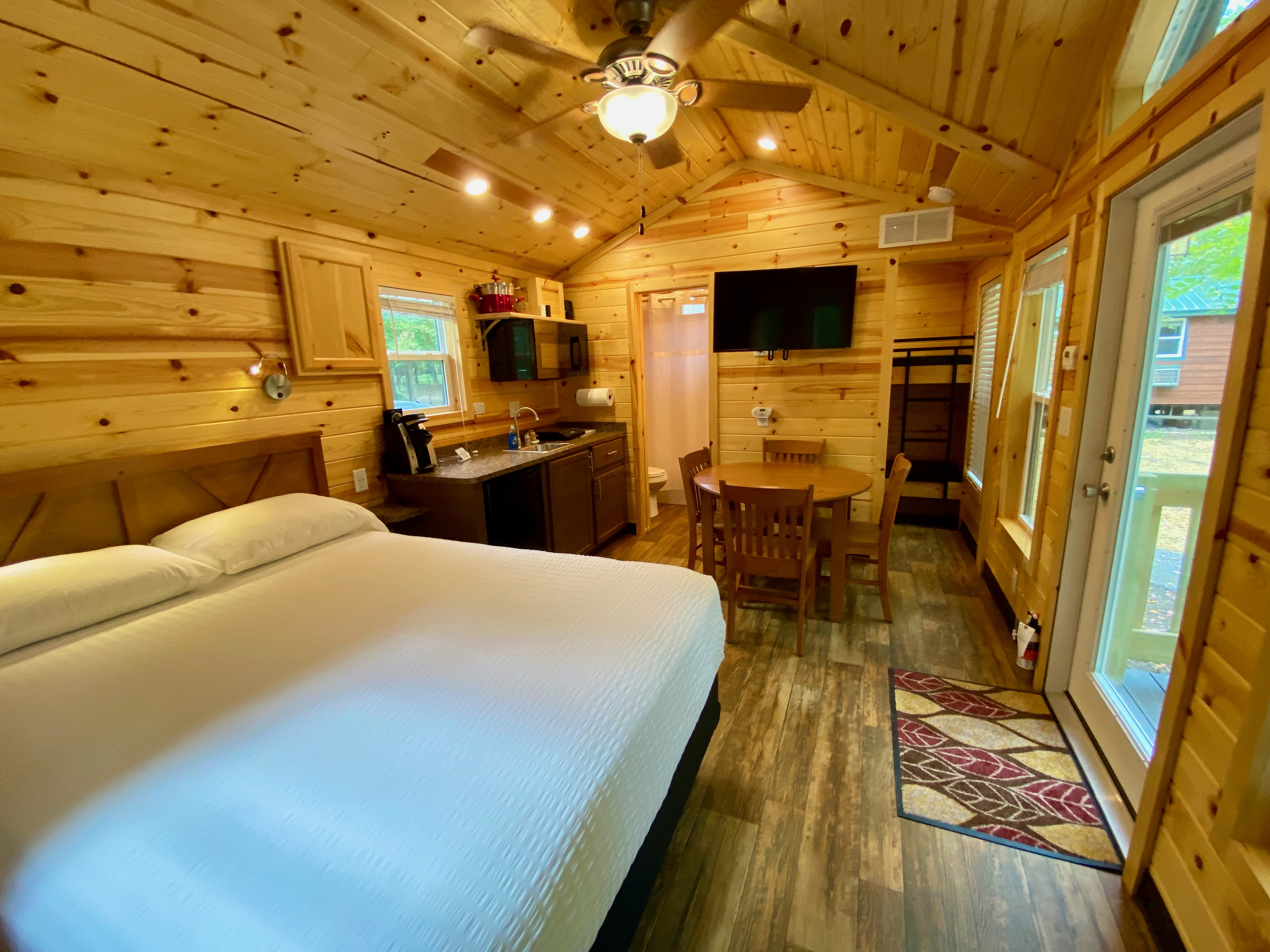 Deluxe Cabin (Full Bath with Tub & Shower), KOA Patio ® Studio Style Pictures - Coshocton KOA ...