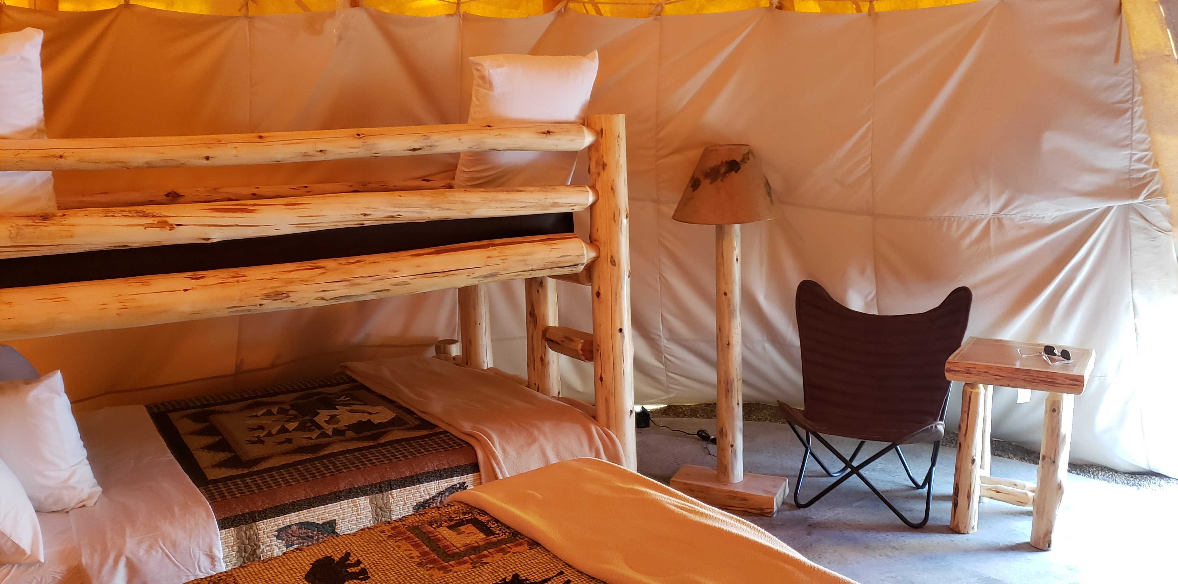bunk bed and chair in teepee